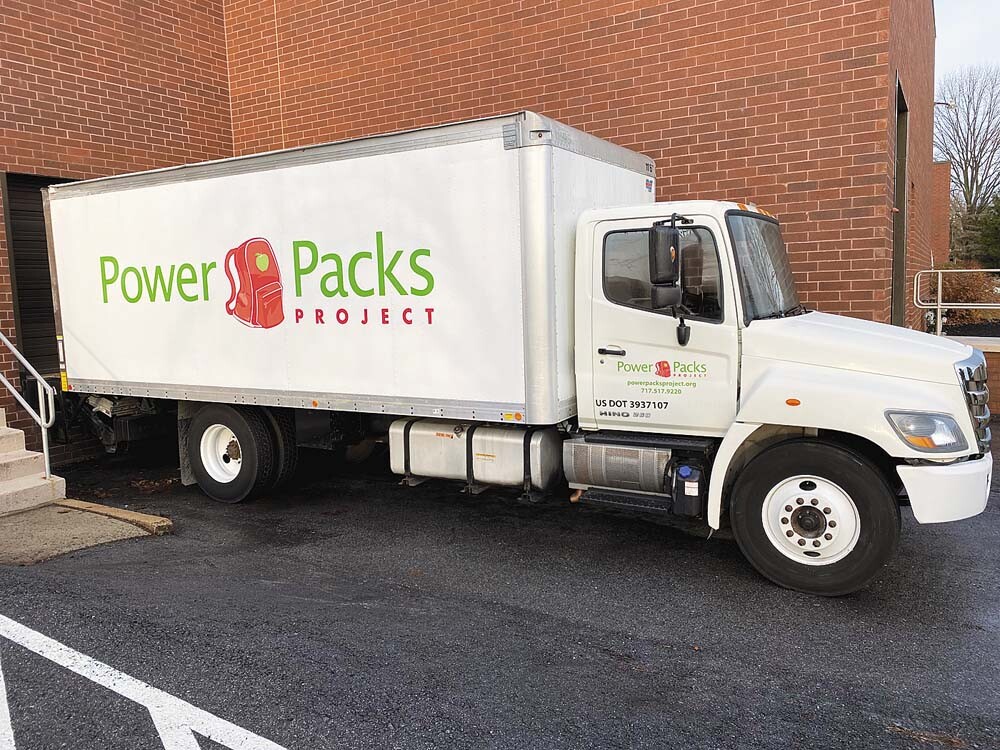 Grant Provides Truck To Power Packs Project | TownLively